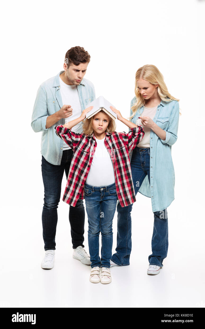 Full length portrait of a family having and argument with a child ...