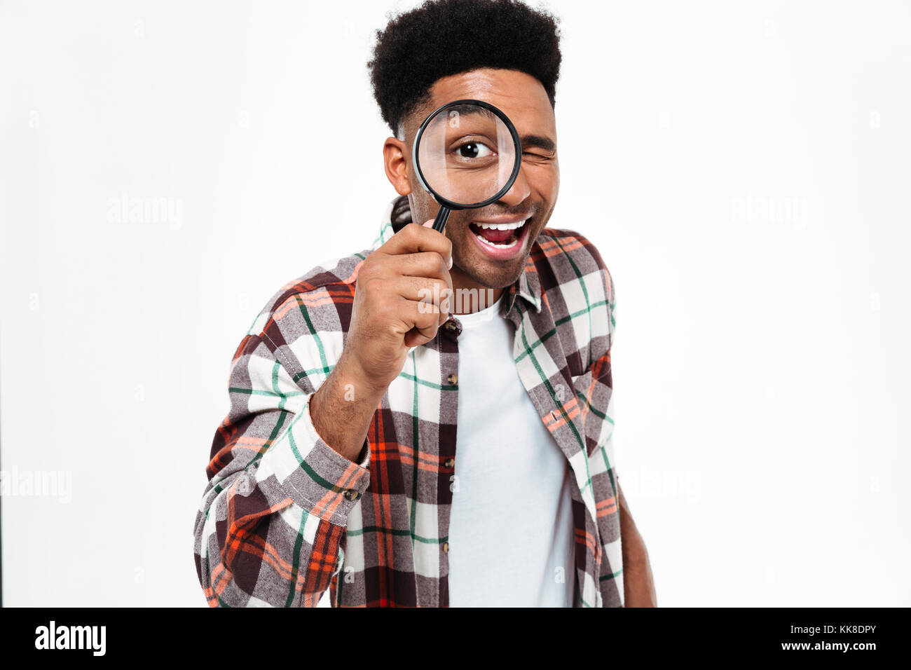 Black Man Looking Through Magnifying Glass