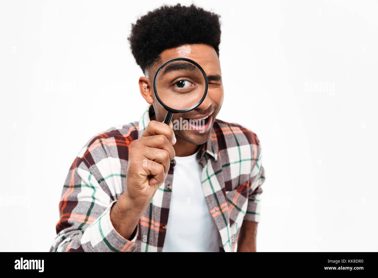 Black Man Looking Through Magnifying Glass