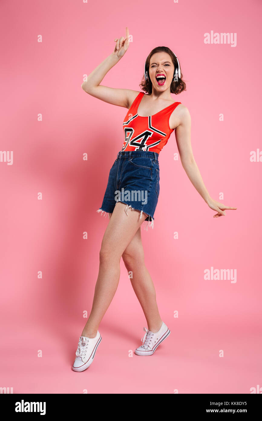 Image of excited amazing young lady dancing isolated pink background ...