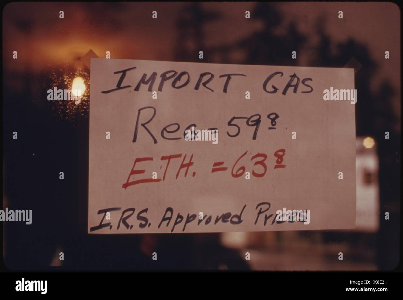 Color photograph of a handwritten sign on a window relating the prices ...