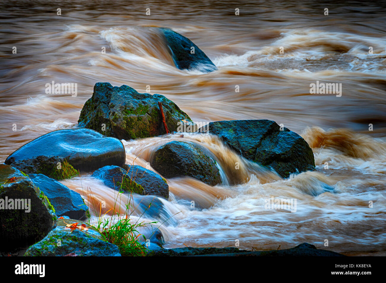 Rising waters from fall rains dredges up the river sediments along the ...