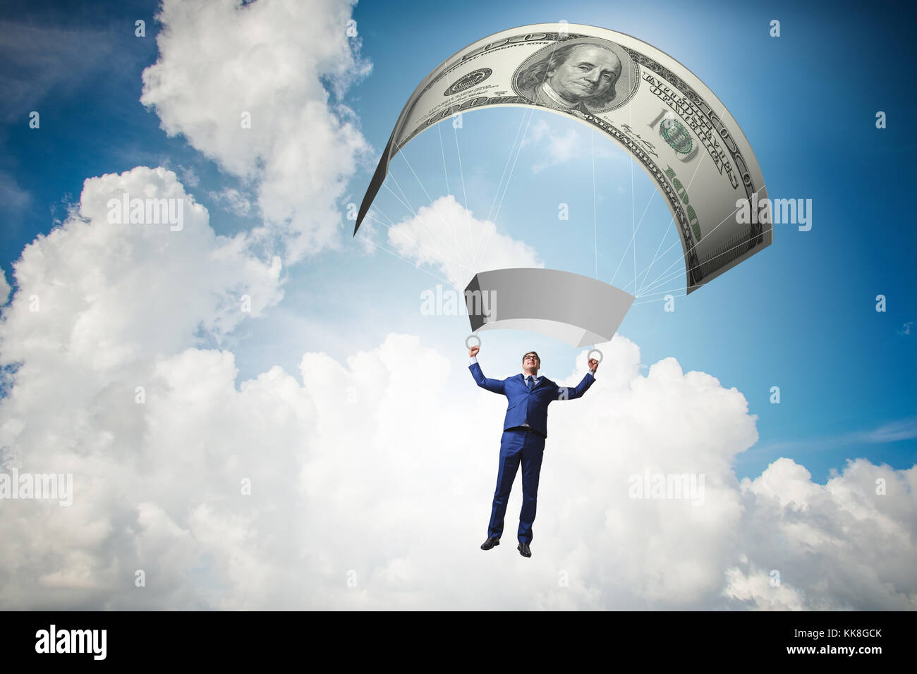 Businessman in golden parachute concept Stock Photo - Alamy