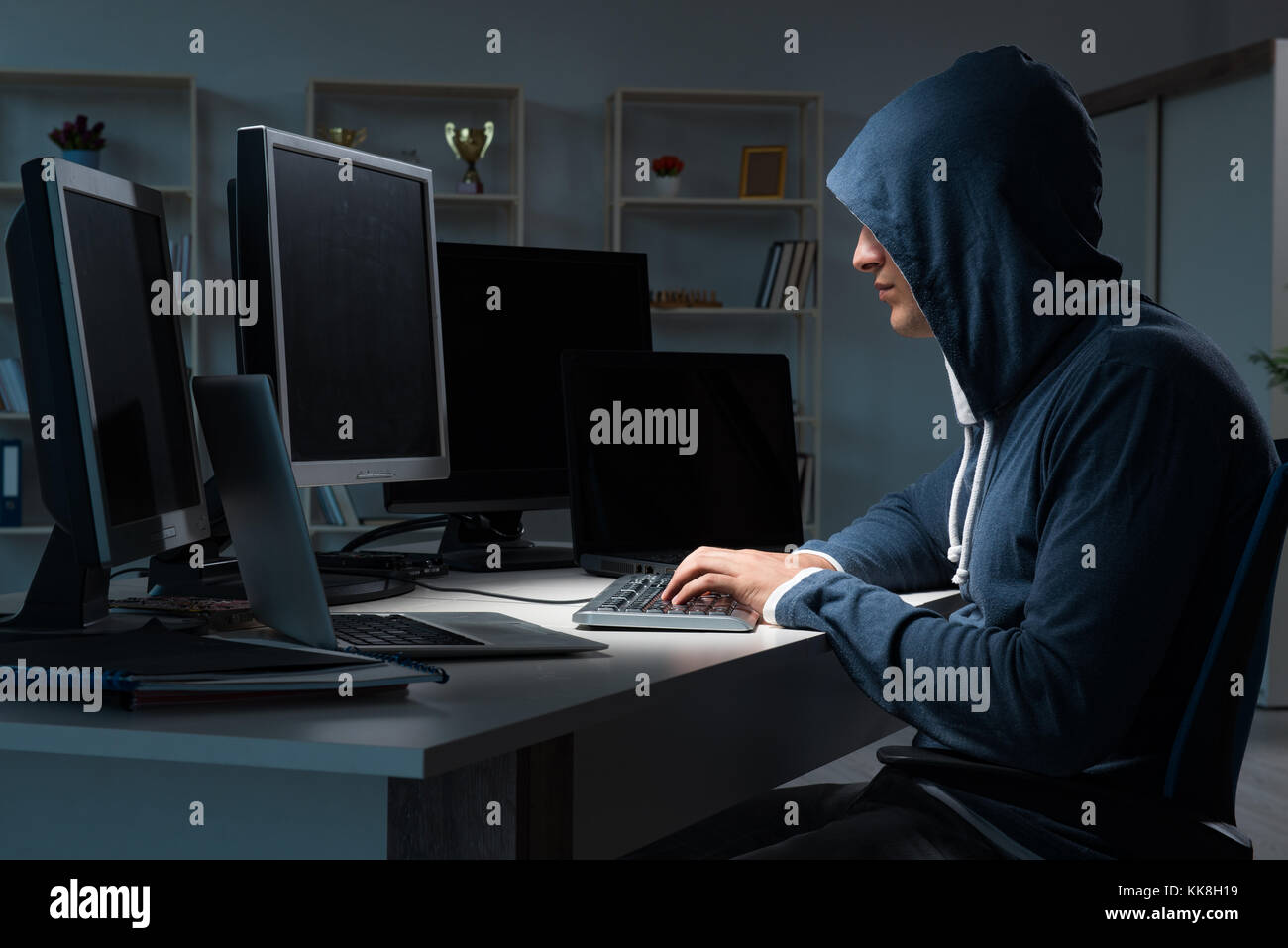 Hacker hacking computer at night Stock Photo - Alamy