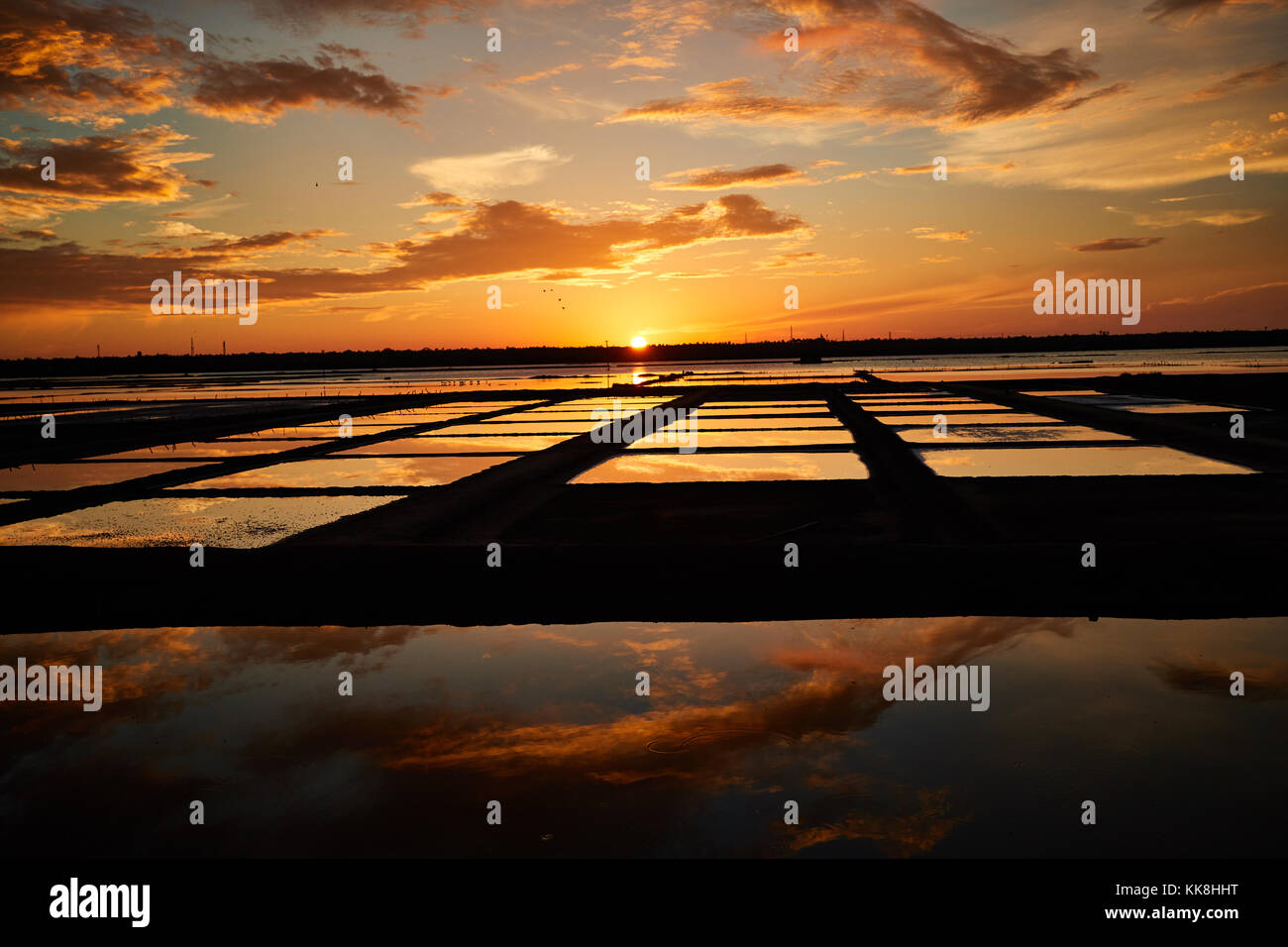 golden color sunset sky evening at salt pan background Stock Photo - Alamy