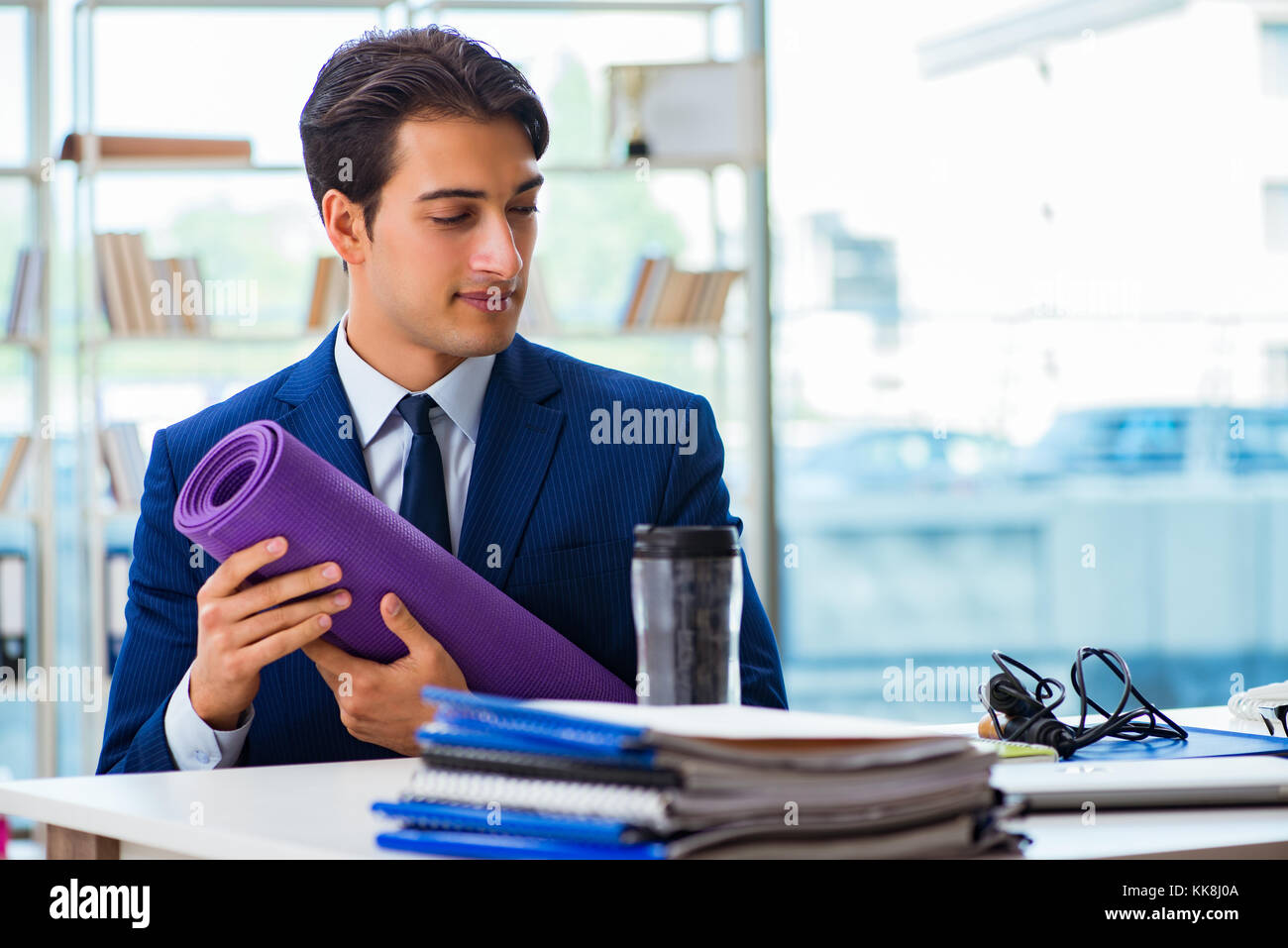 Man getting ready for sports break in the office Stock Photo - Alamy