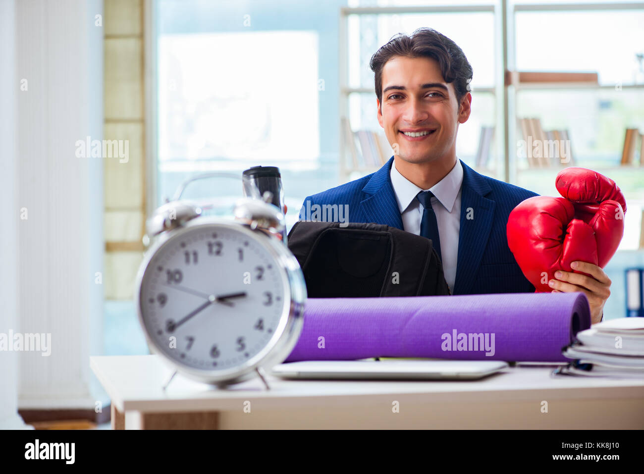 Man with boxing gloves in the office Stock Photo - Alamy