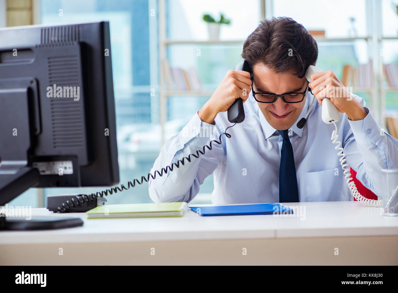 Unhappy angry call center worker frustrated with workload Stock Photo ...