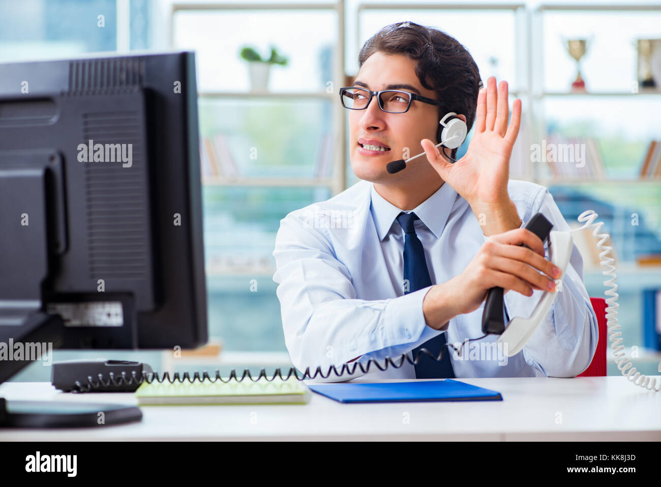 Unhappy angry call center worker frustrated with workload Stock Photo ...