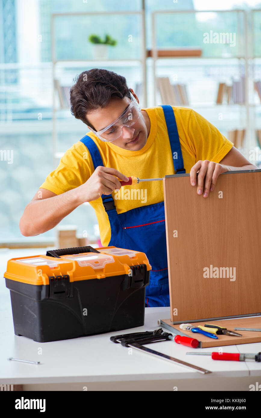 Furniture carpenter working in the workshop Stock Photo - Alamy