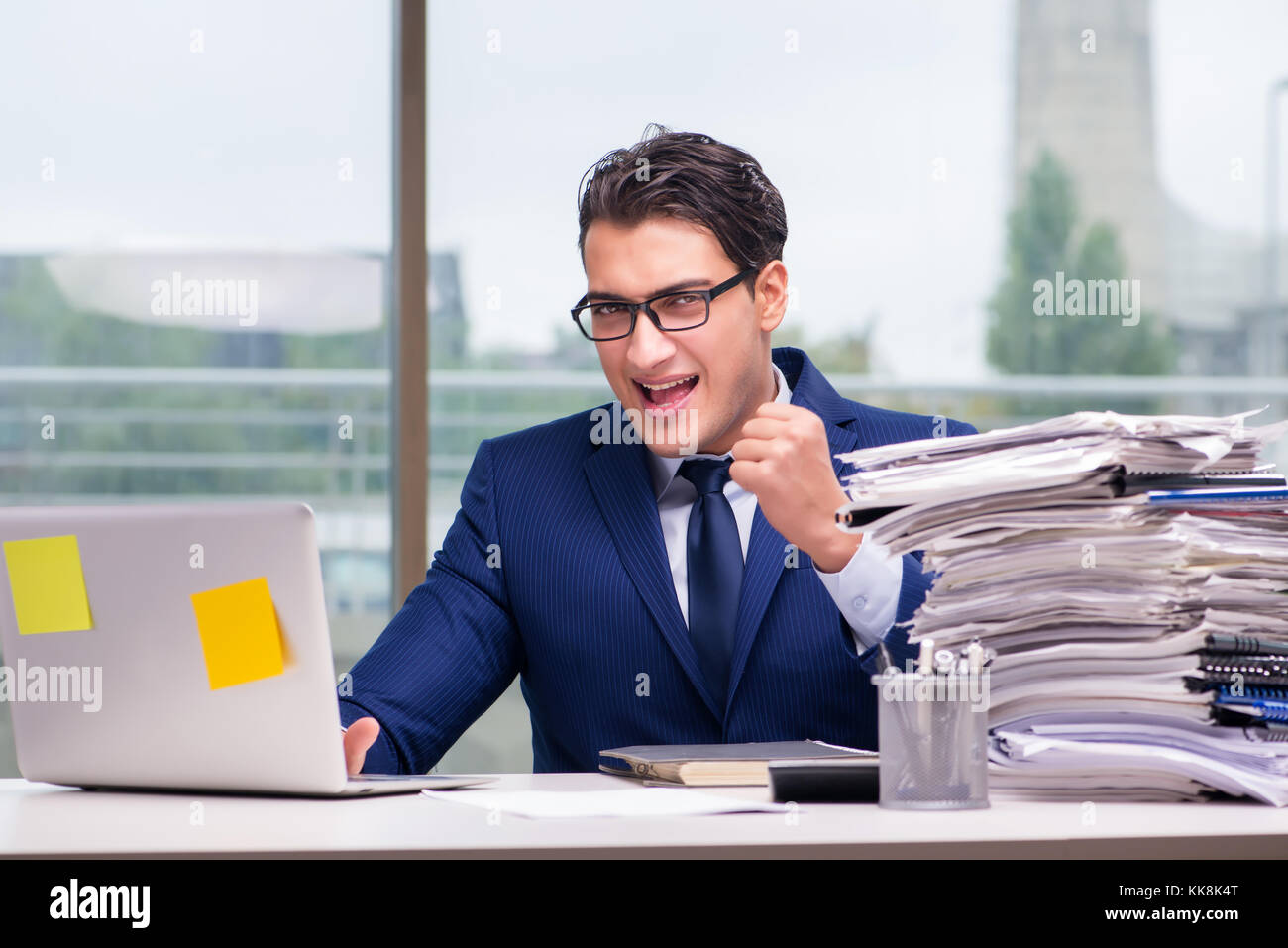 Workaholic businessman overworked with too much work in office Stock ...