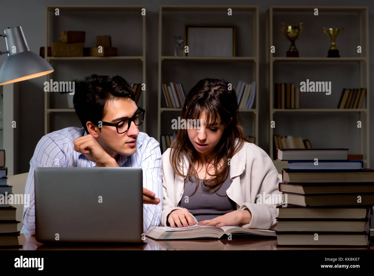 Two students studying late preparing for exams Stock Photo - Alamy