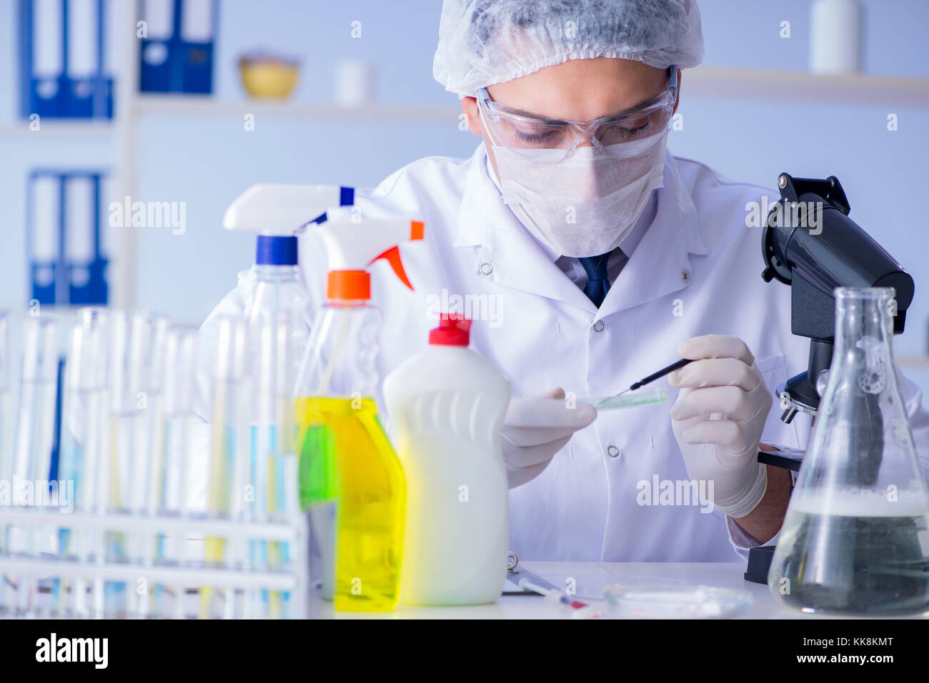Man in the lab testing new cleaning solution detergent Stock Photo - Alamy