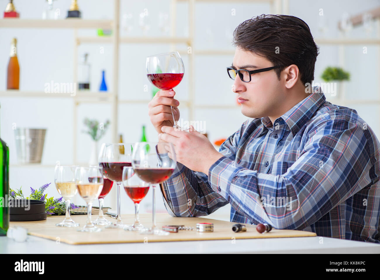 Professional sommelier tasting red wine Stock Photo - Alamy