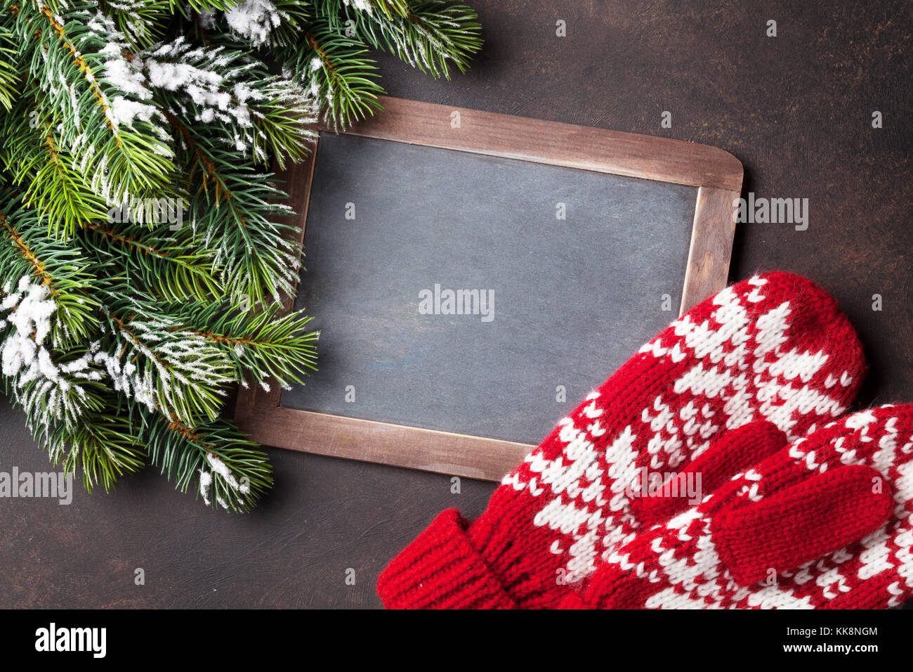 Christmas fir tree, mittens and chalkboard for your greetings. Top view ...