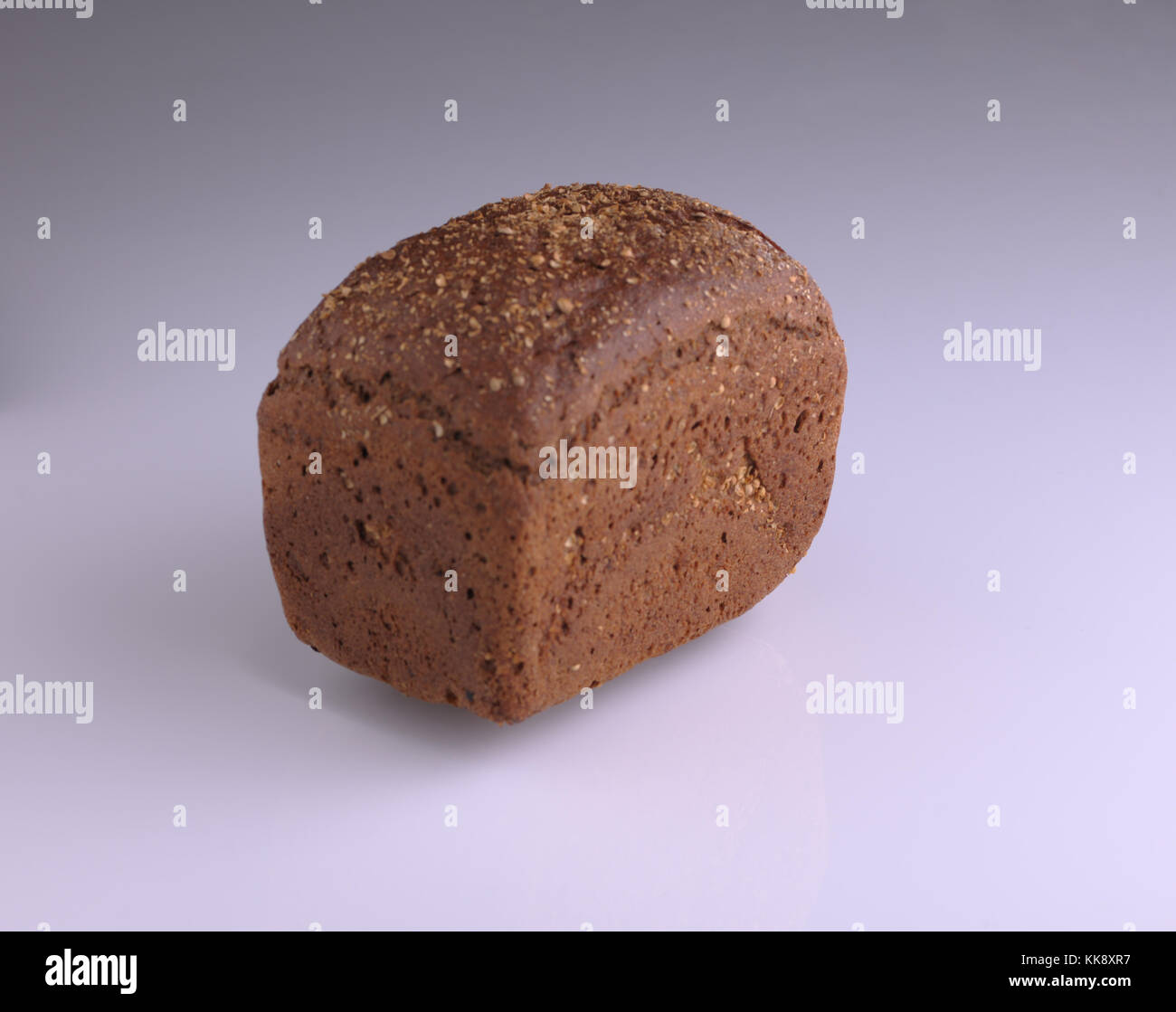 one loaf of bread close-up on a white background with reflection Stock ...