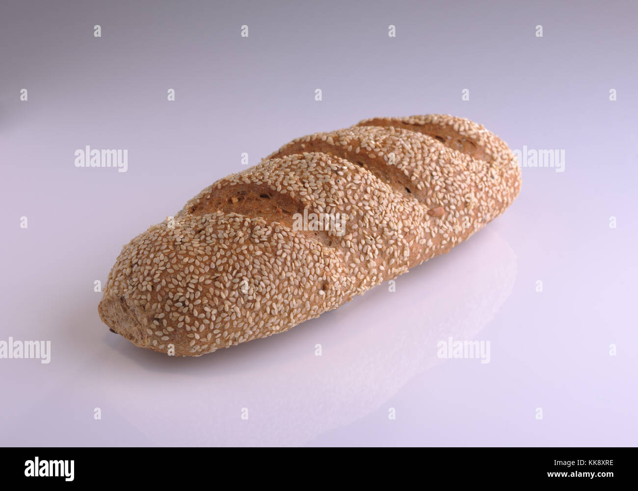 one loaf of bread close-up on a white background with reflection Stock ...