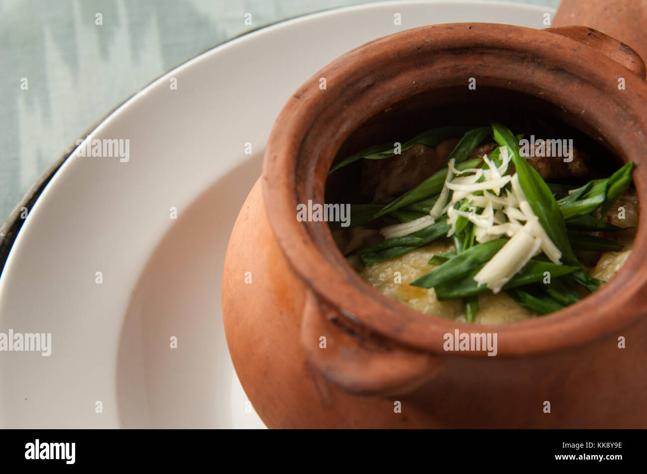 dish in a clay pot closeup Stock Photo - Alamy