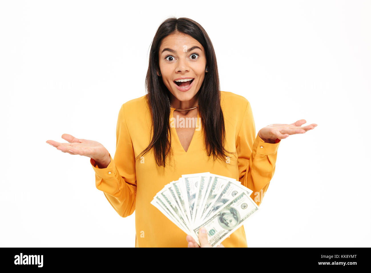 Portrait of a satisfied happy woman receiving bunch of money banknotes ...