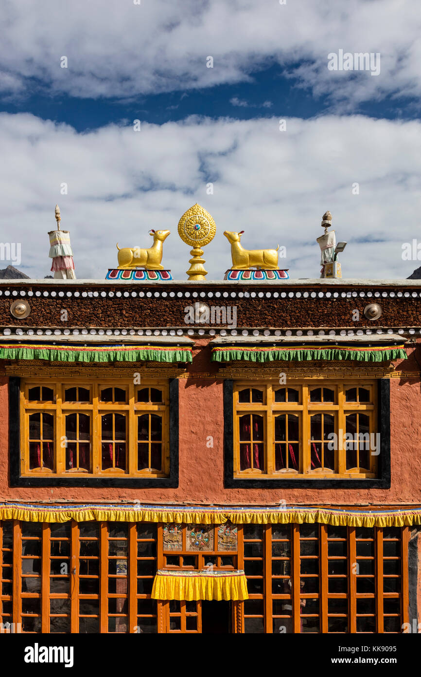 Golden deer and Dharma Wheel on the roof of the RANGDUM MONASTERY ...