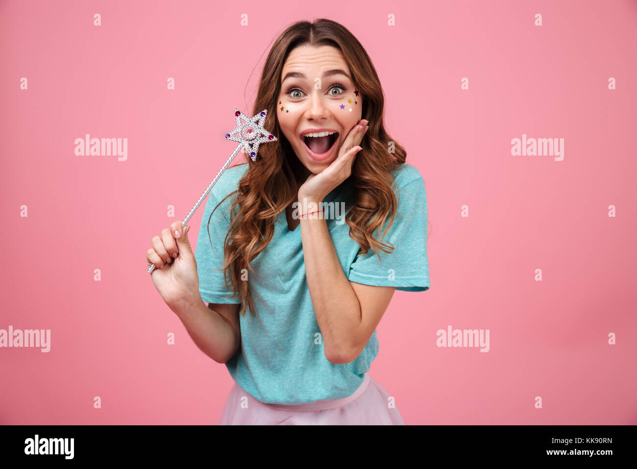 Image of surprised emotional young woman isolated over pink background ...