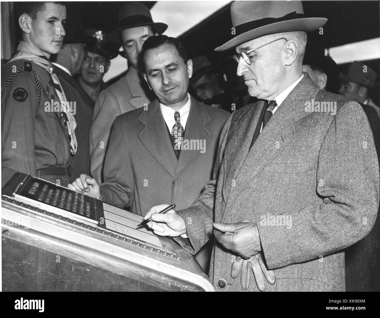 Photograph of President Harry S. Truman as He Signs the Guestbook of ...