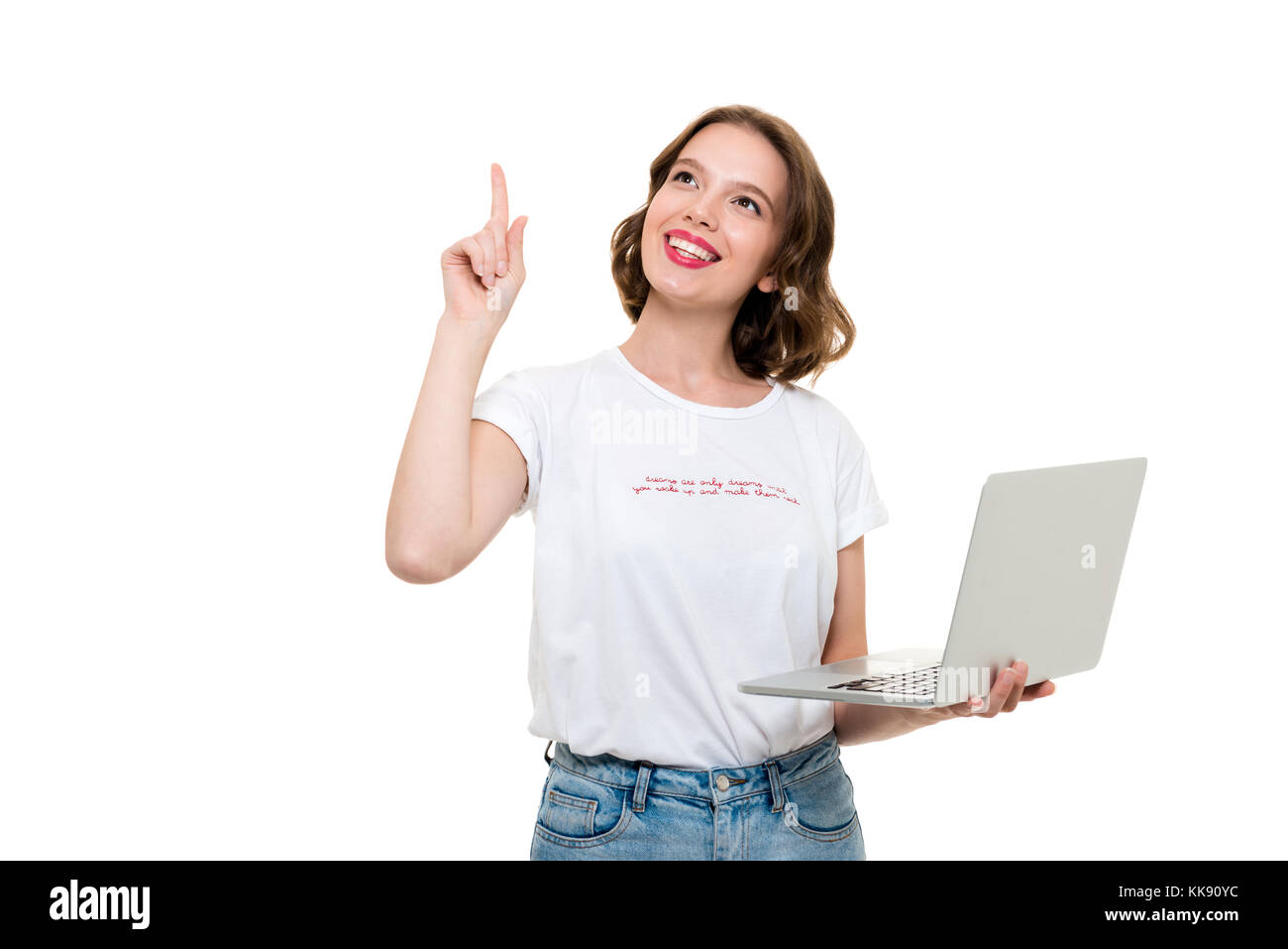 Portrait of a happy young girl having an idea while holding laptop ...