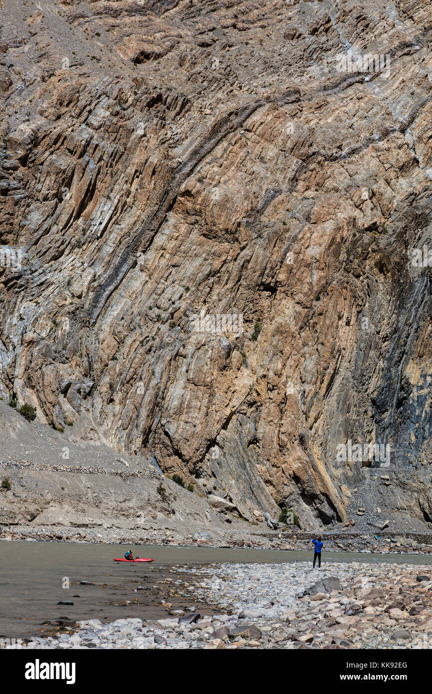 Geological rock formation rise above a kayaker on the STOD RIVER ...