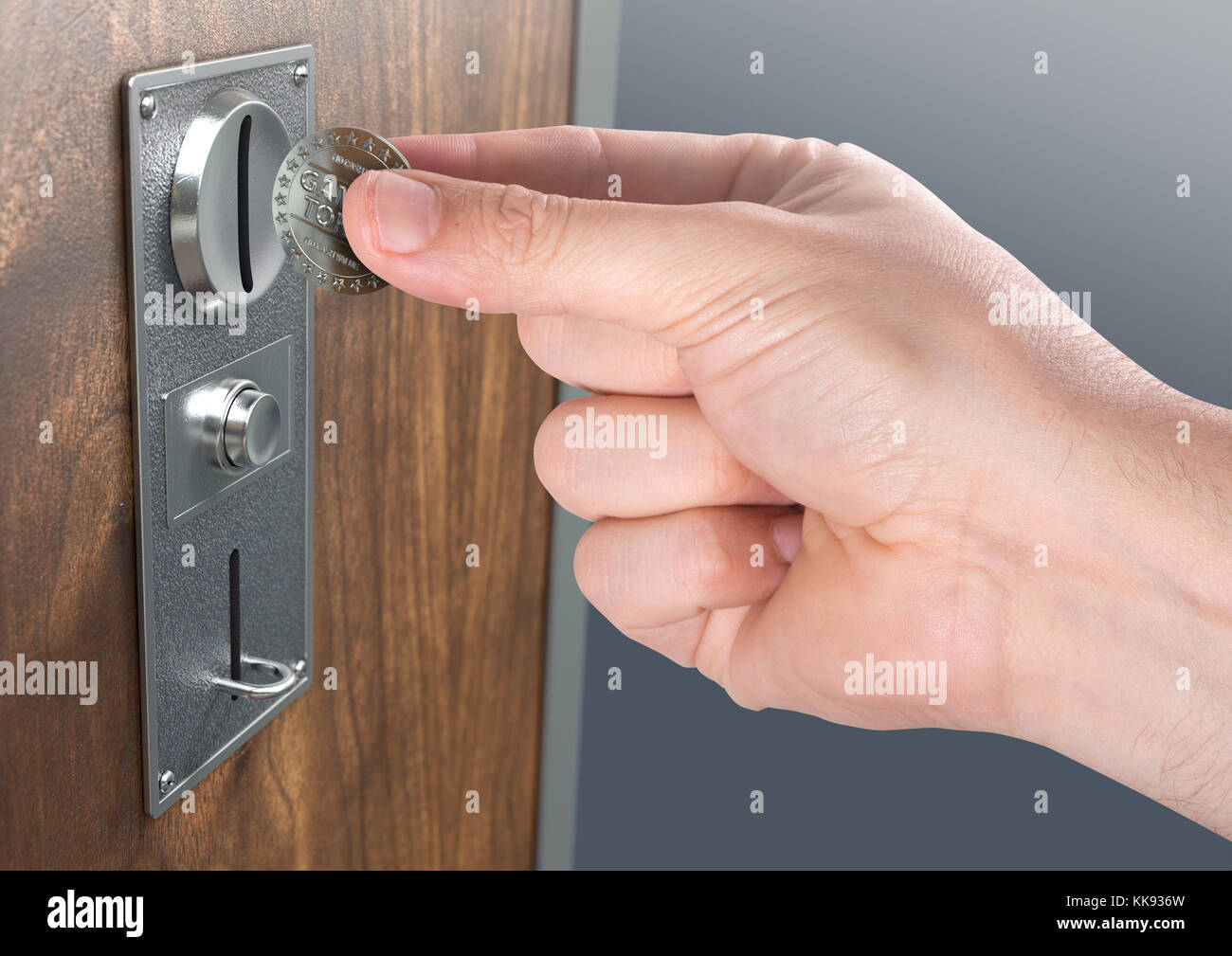 A male hand ready to insert a token into the slot of a vintage chrome ...