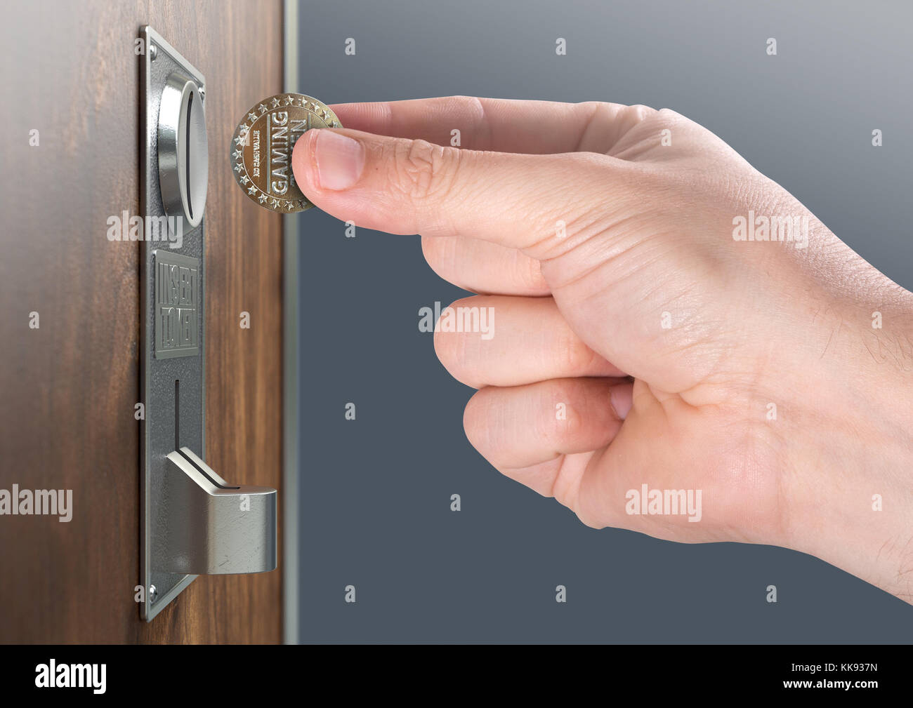 A male hand ready to insert a token into the slot of a vintage chrome ...