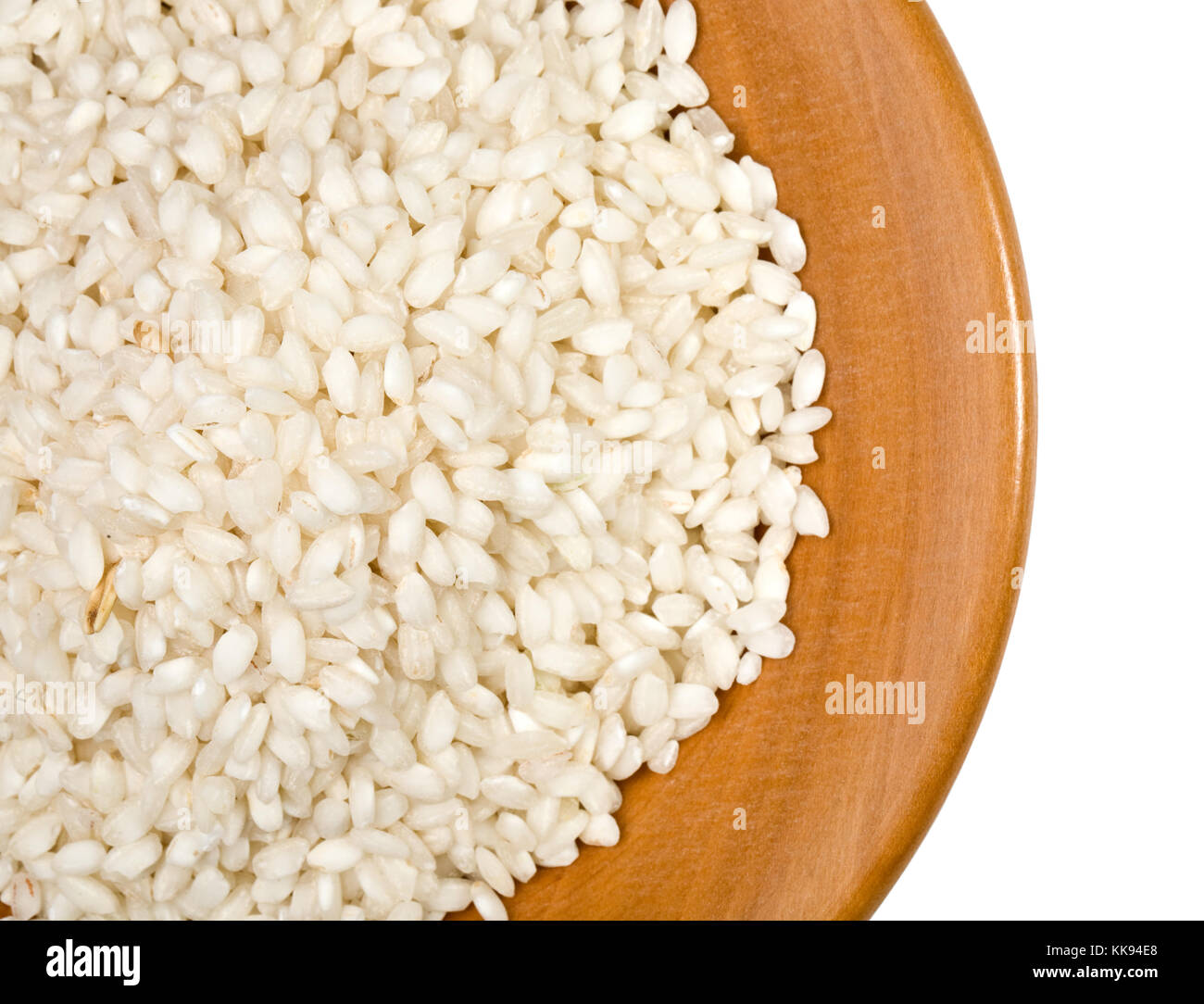 rice in wood plate close up isolated on white background Stock Photo ...