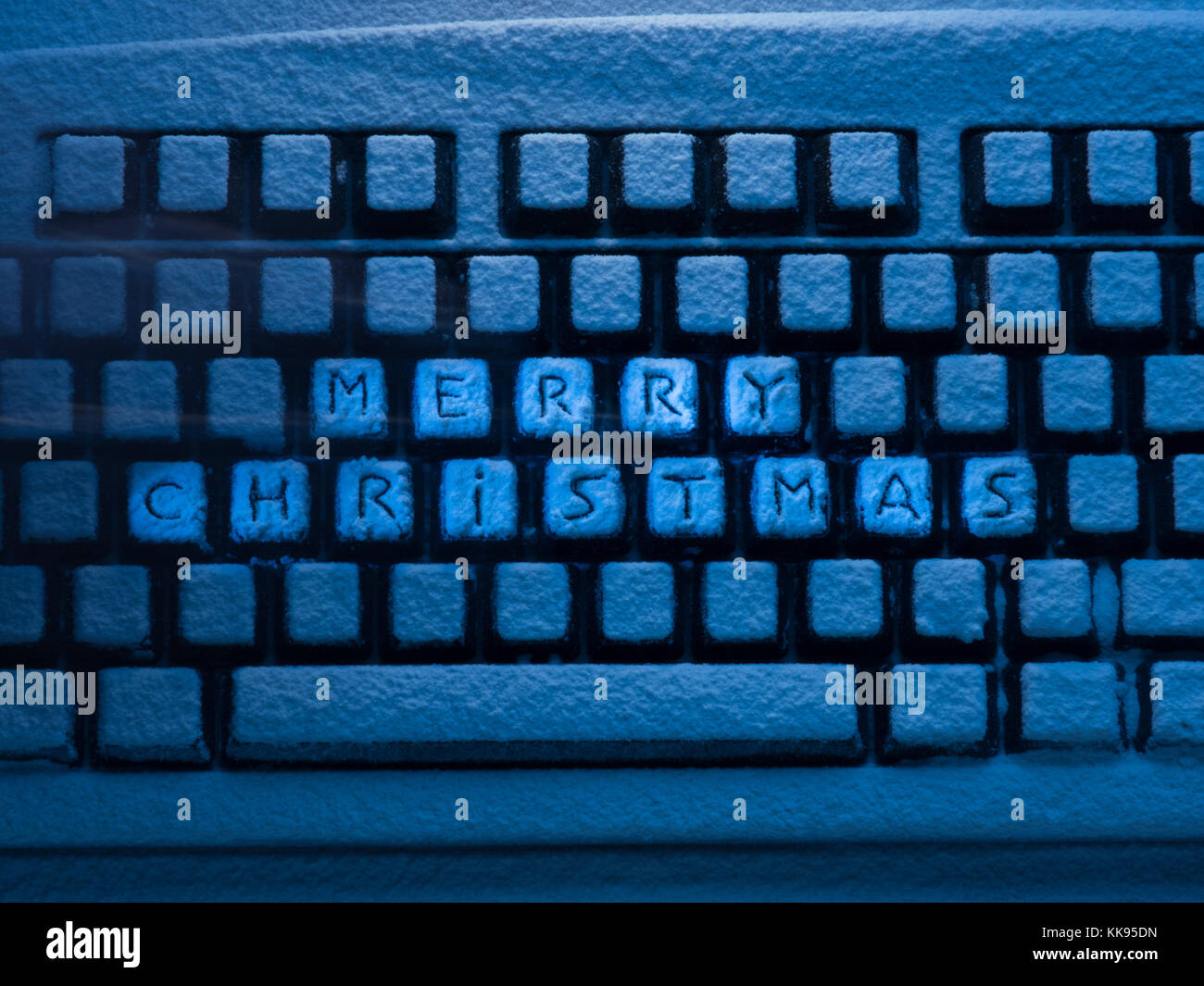 computer keyboard with lettering merry christmas on buttons covered ...