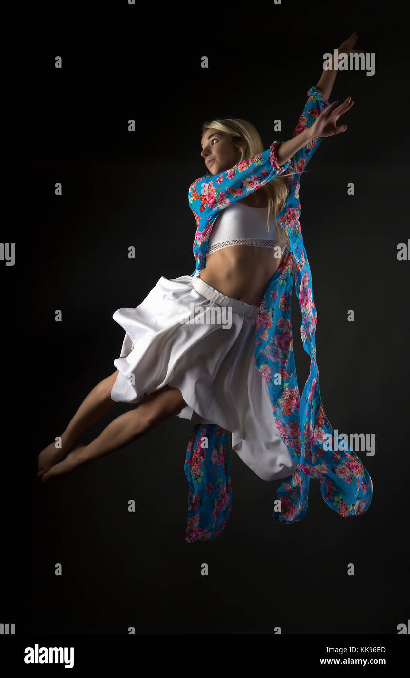 Studio dancing female mid air jumps Stock Photo - Alamy