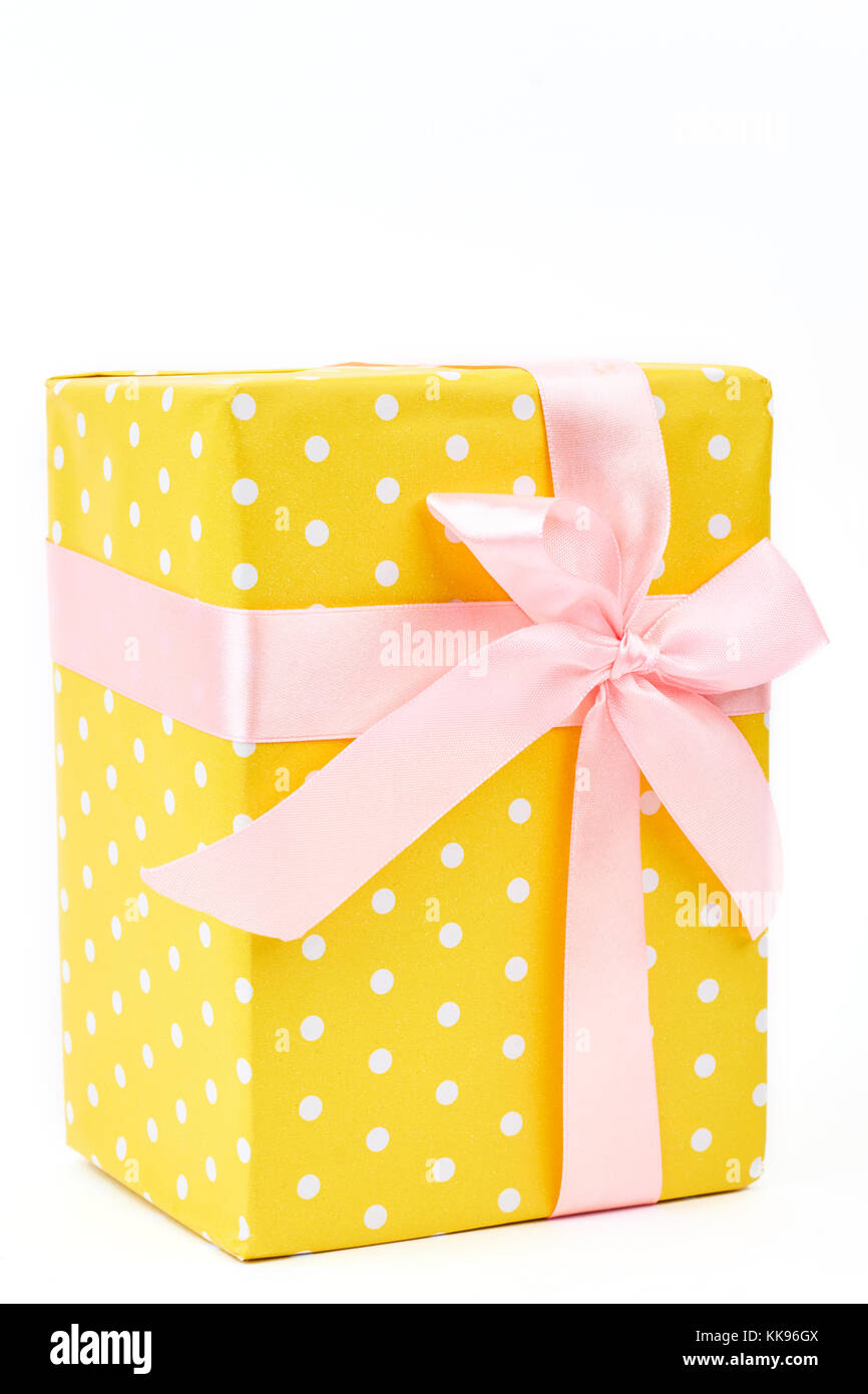 Beautiful yellow gift box close up Stock Photo - Alamy