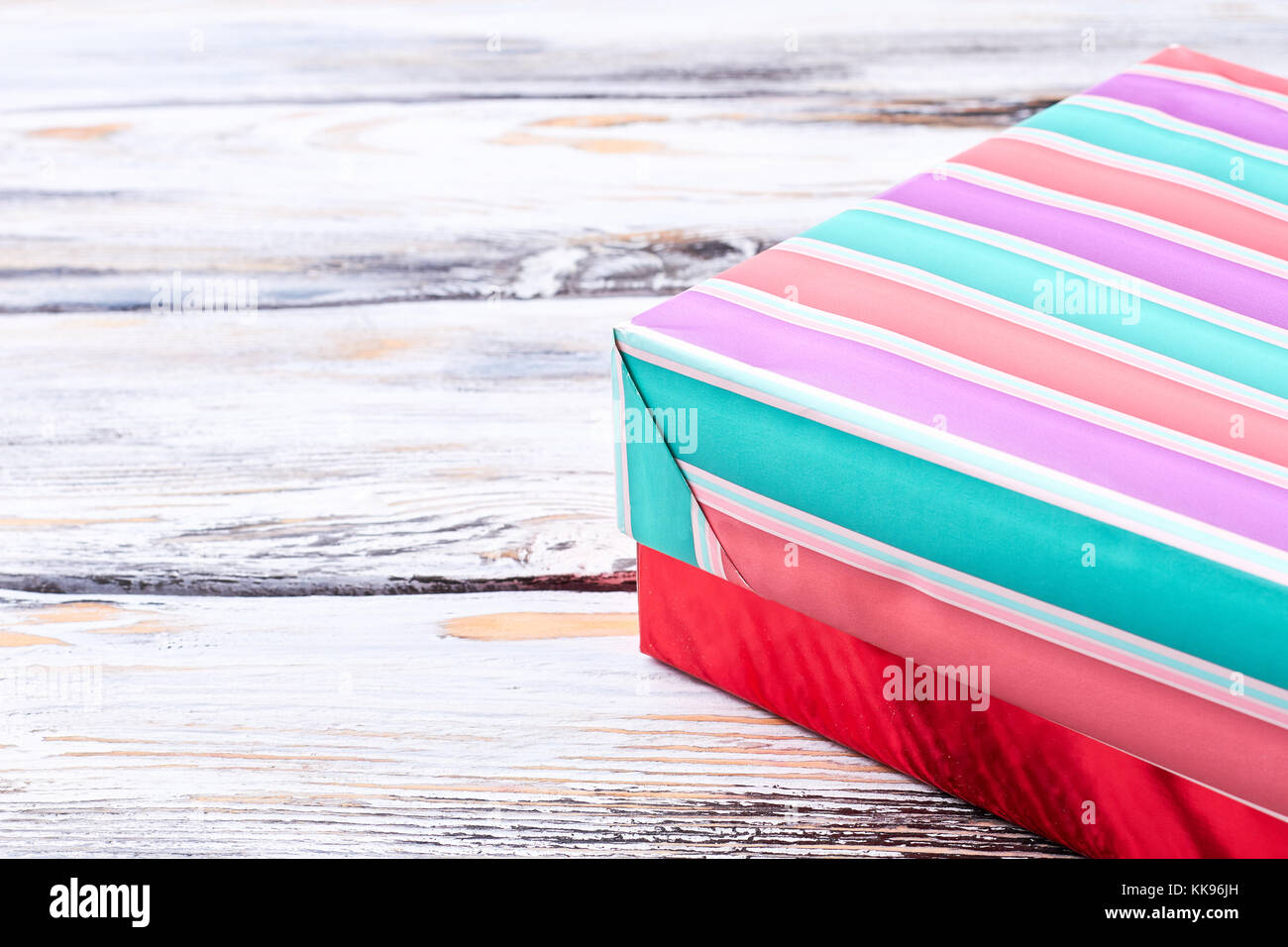 Multicolored striped gift box, cropped image Stock Photo - Alamy