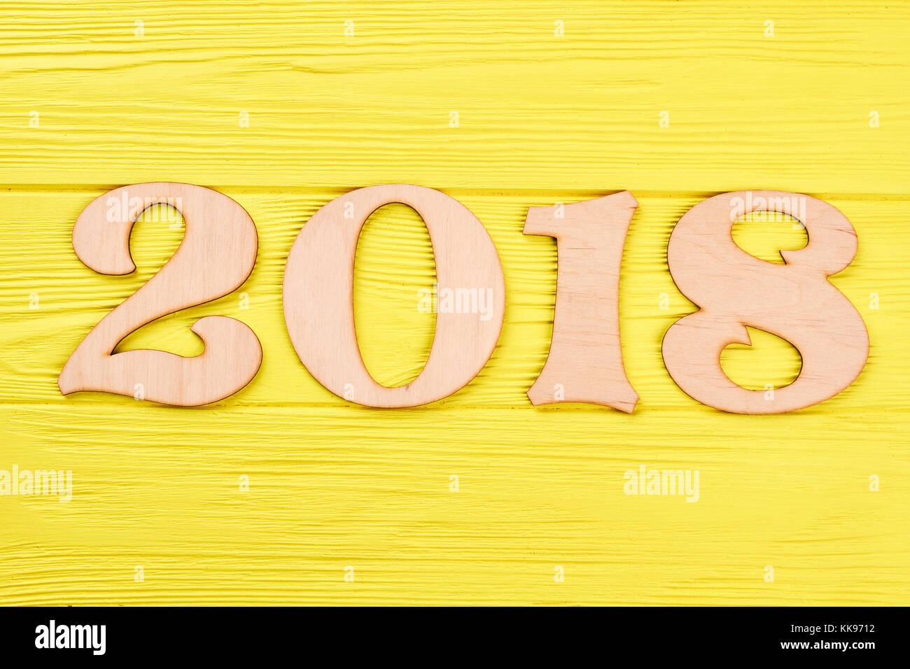 Wooden number 2018 on wooden yellow background Stock Photo - Alamy