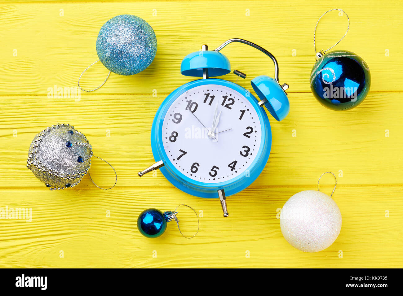 Christmas decorative balls and alarm clock Stock Photo - Alamy