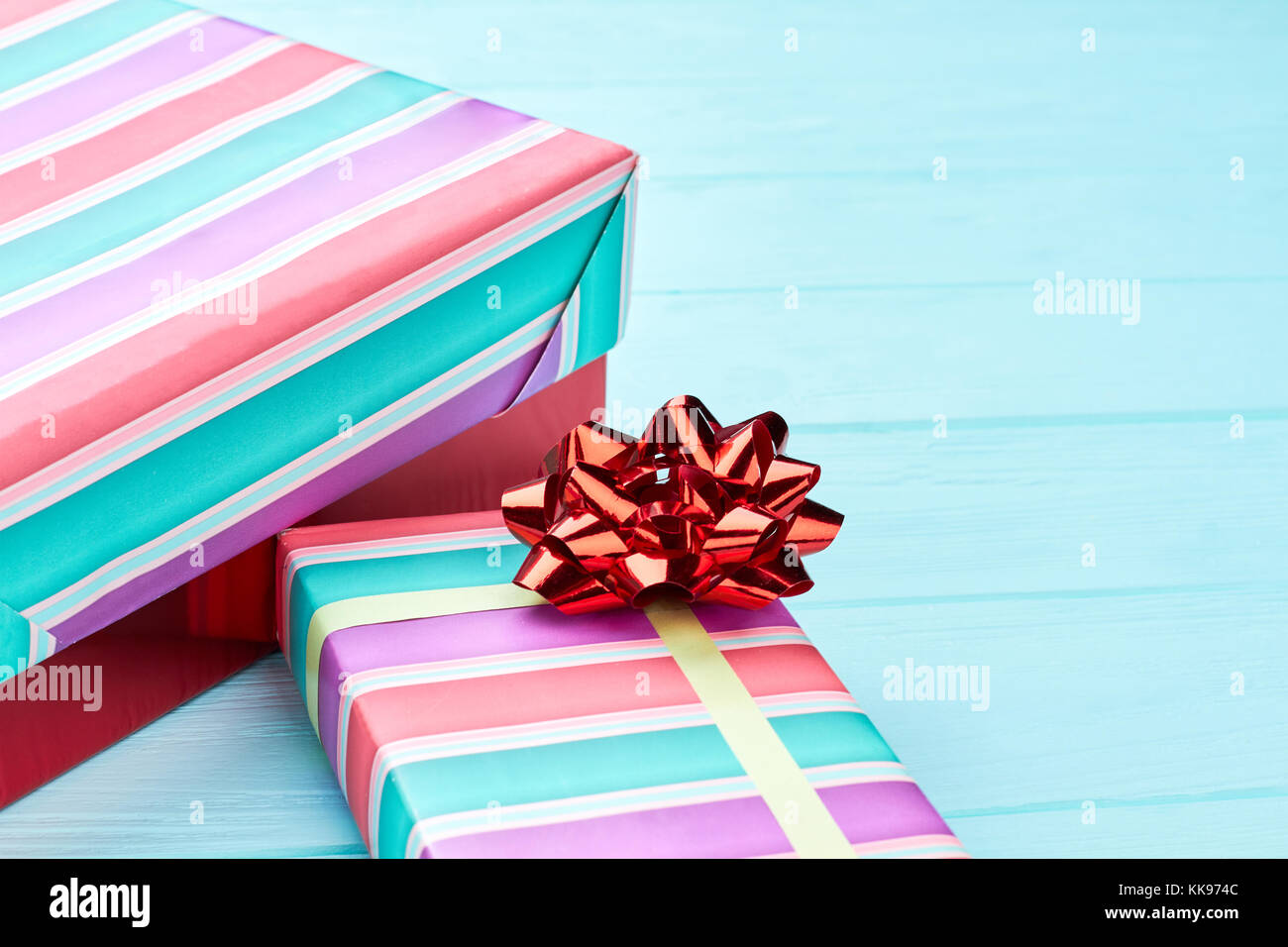 Striped gift box with red bow Stock Photo - Alamy