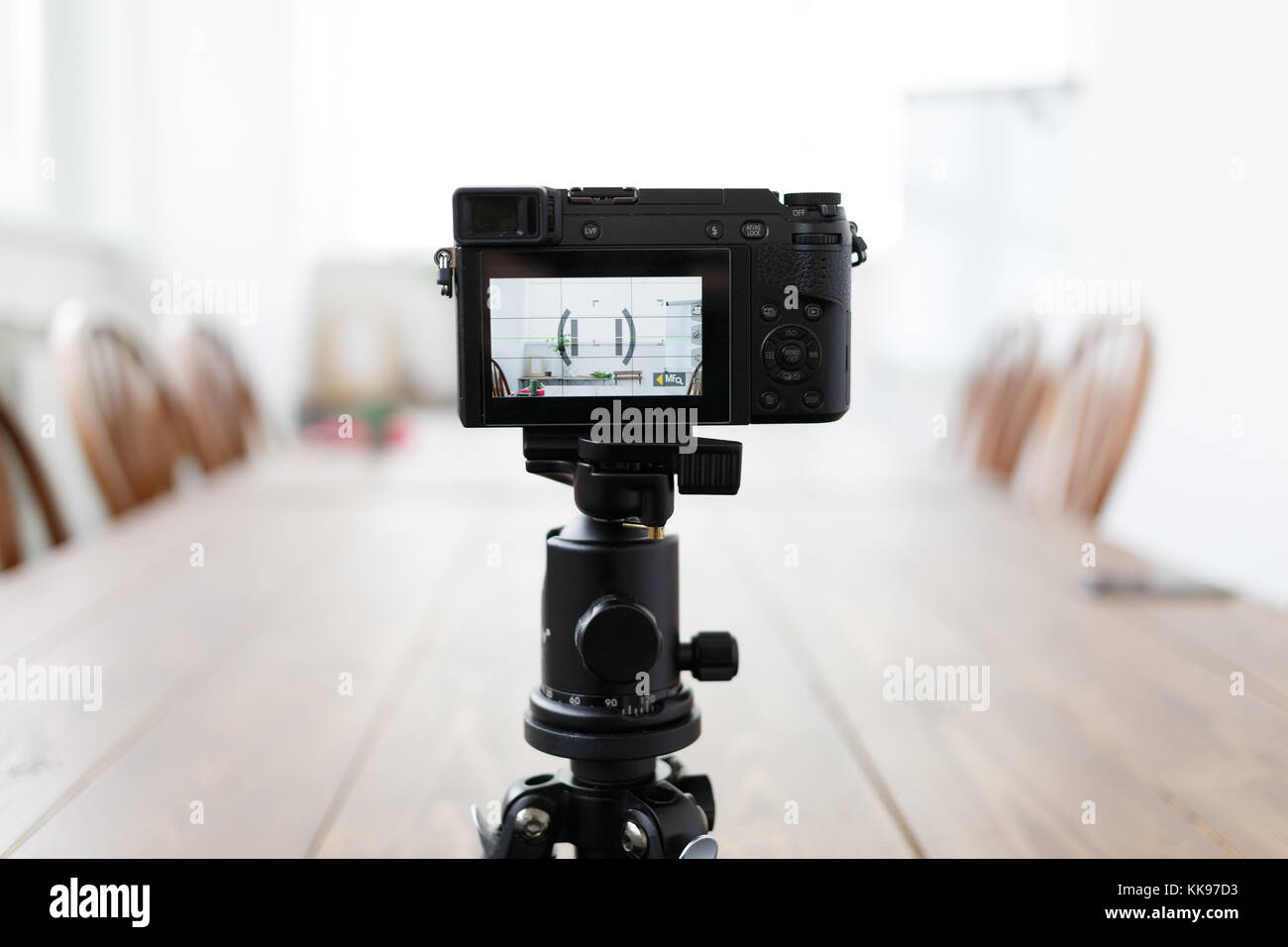 Photo of camera in room with table Stock Photo - Alamy