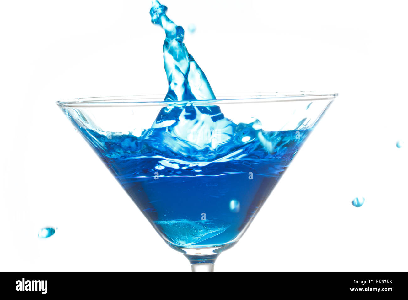 Colorful liquid splashing in a martini glass Stock Photo - Alamy