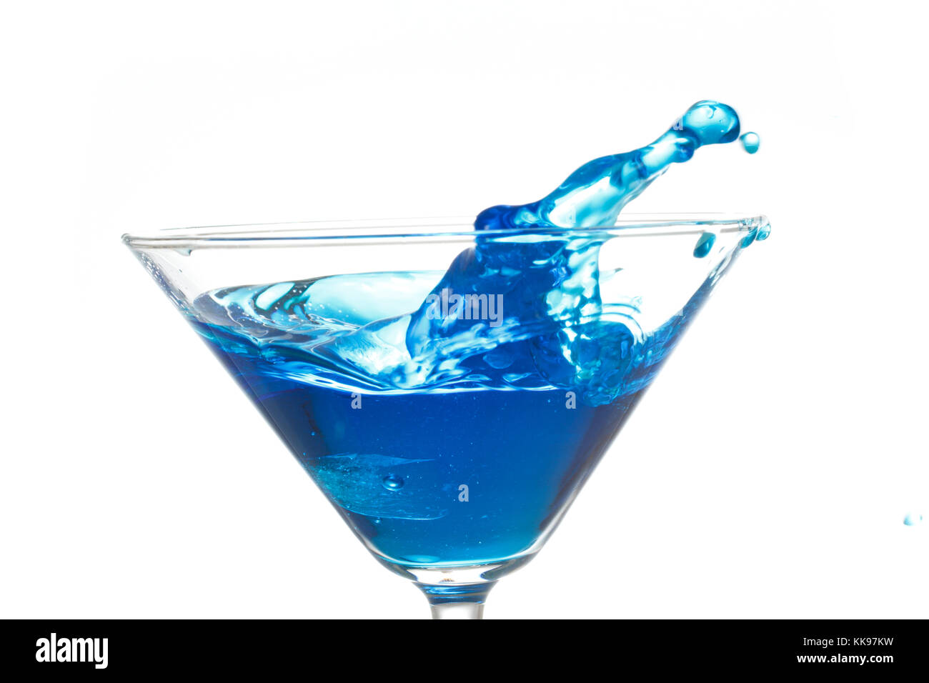Colorful liquid splashing in a martini glass Stock Photo - Alamy