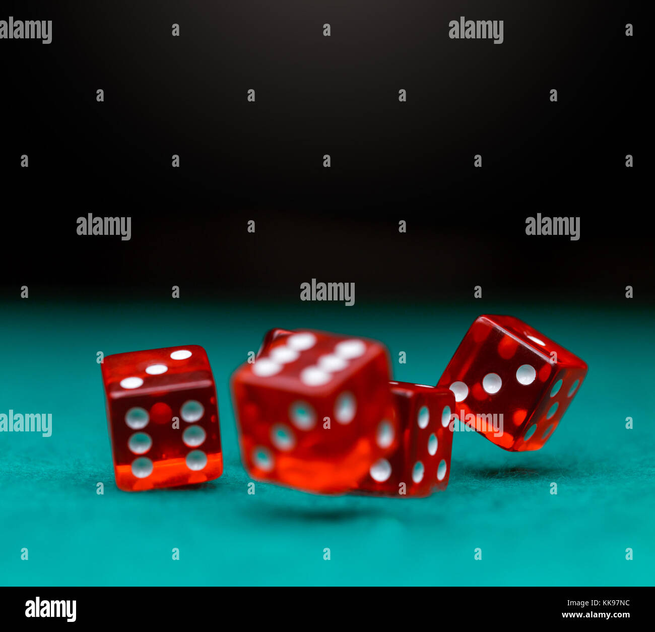 Image of several red dice falling on green table Stock Photo - Alamy
