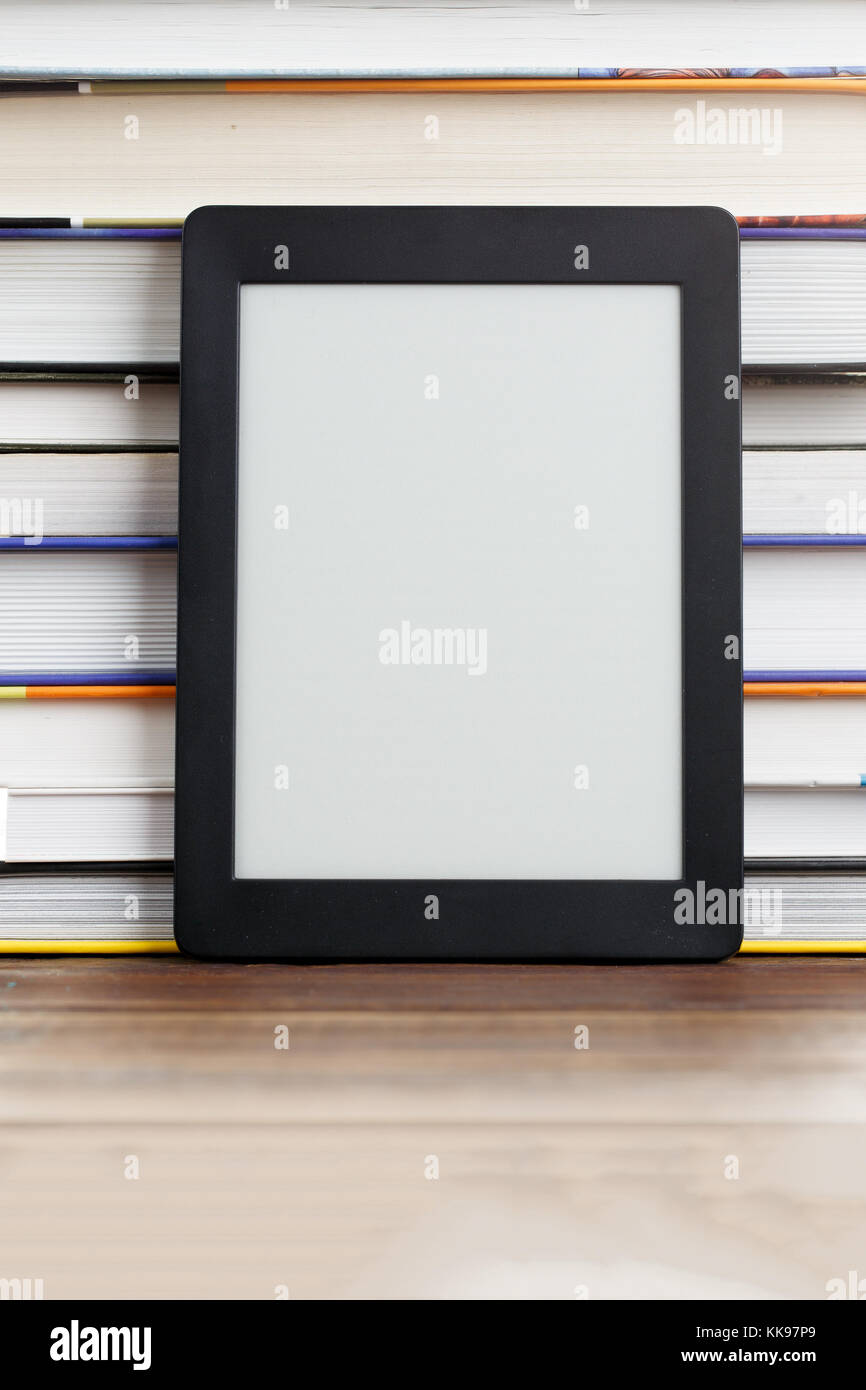 Blank black picture frame next to books Stock Photo - Alamy