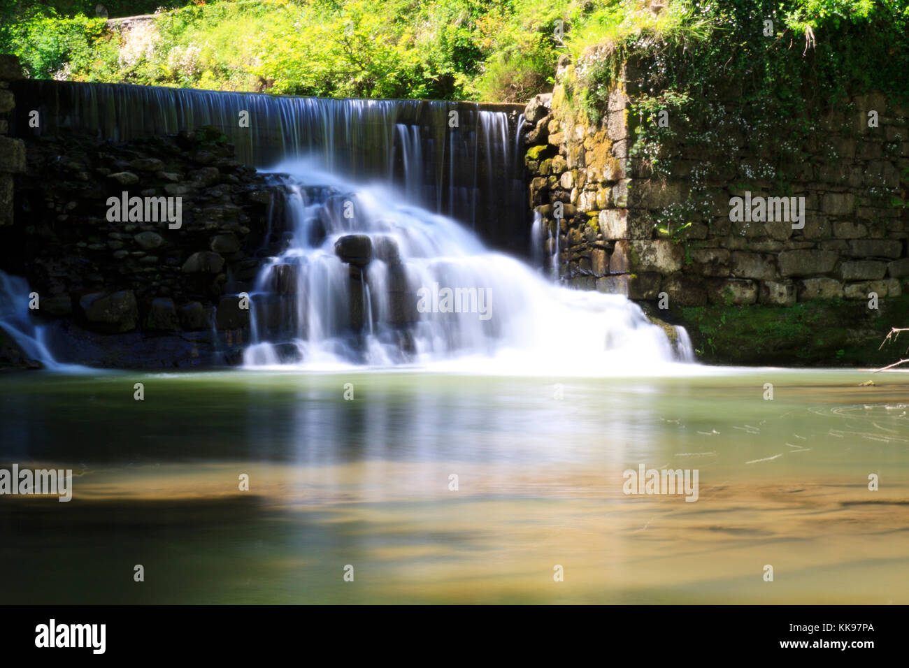 Small waterfall in dark forest hi-res stock photography and images - Alamy
