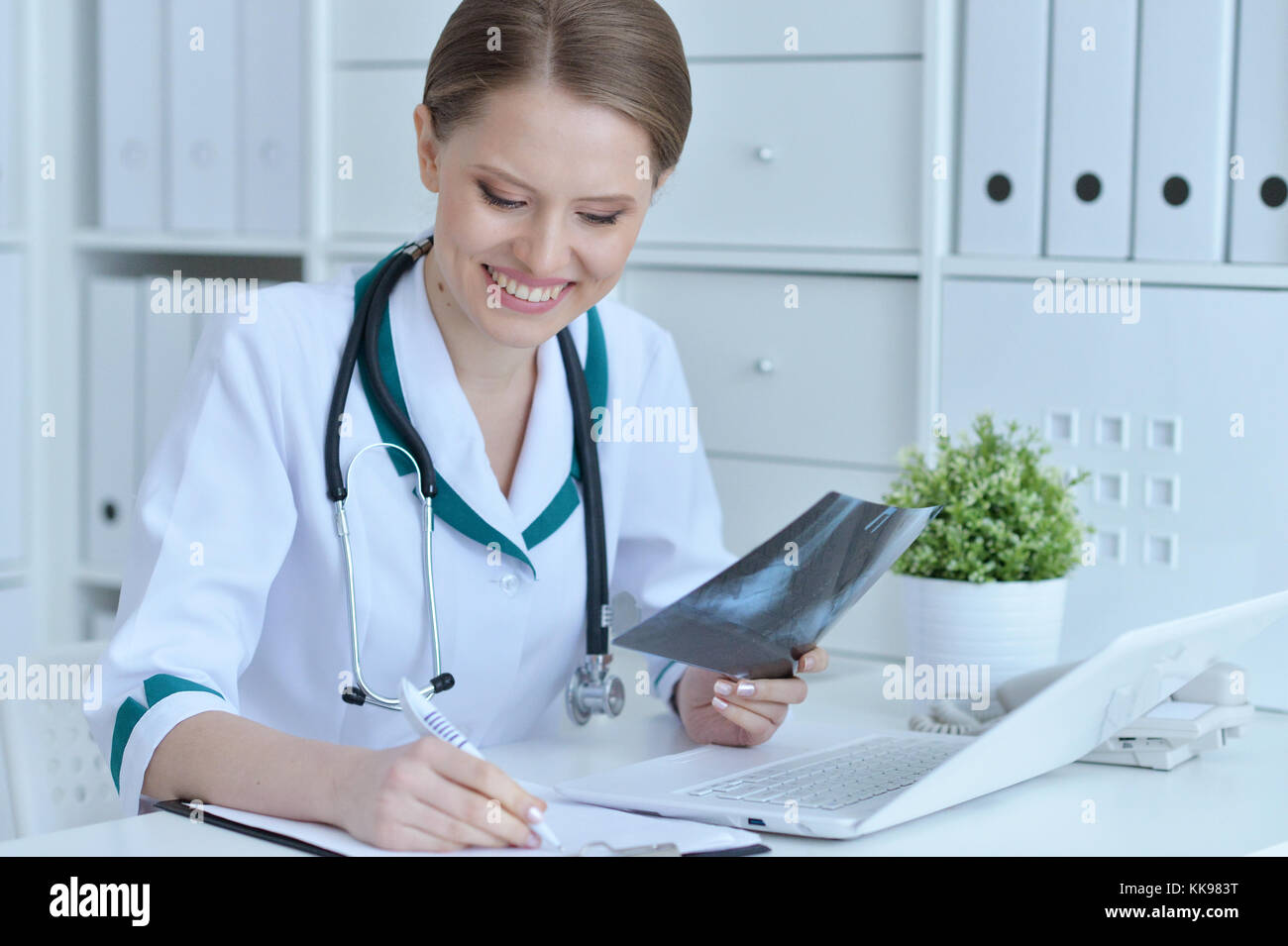 doctor working in office Stock Photo - Alamy
