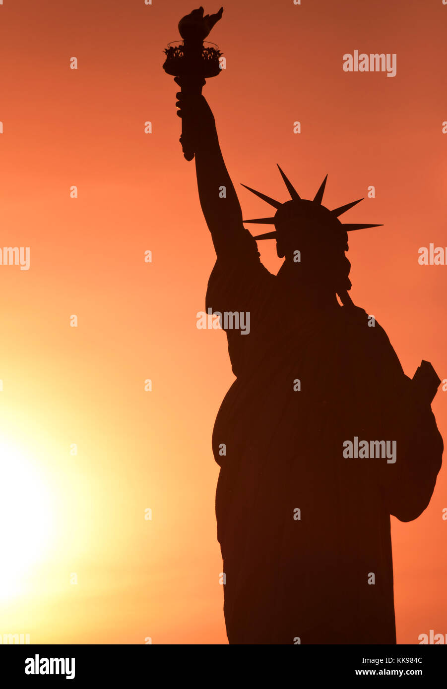 Statue of Liberty at sunset with beautiful warm colors Stock Photo - Alamy