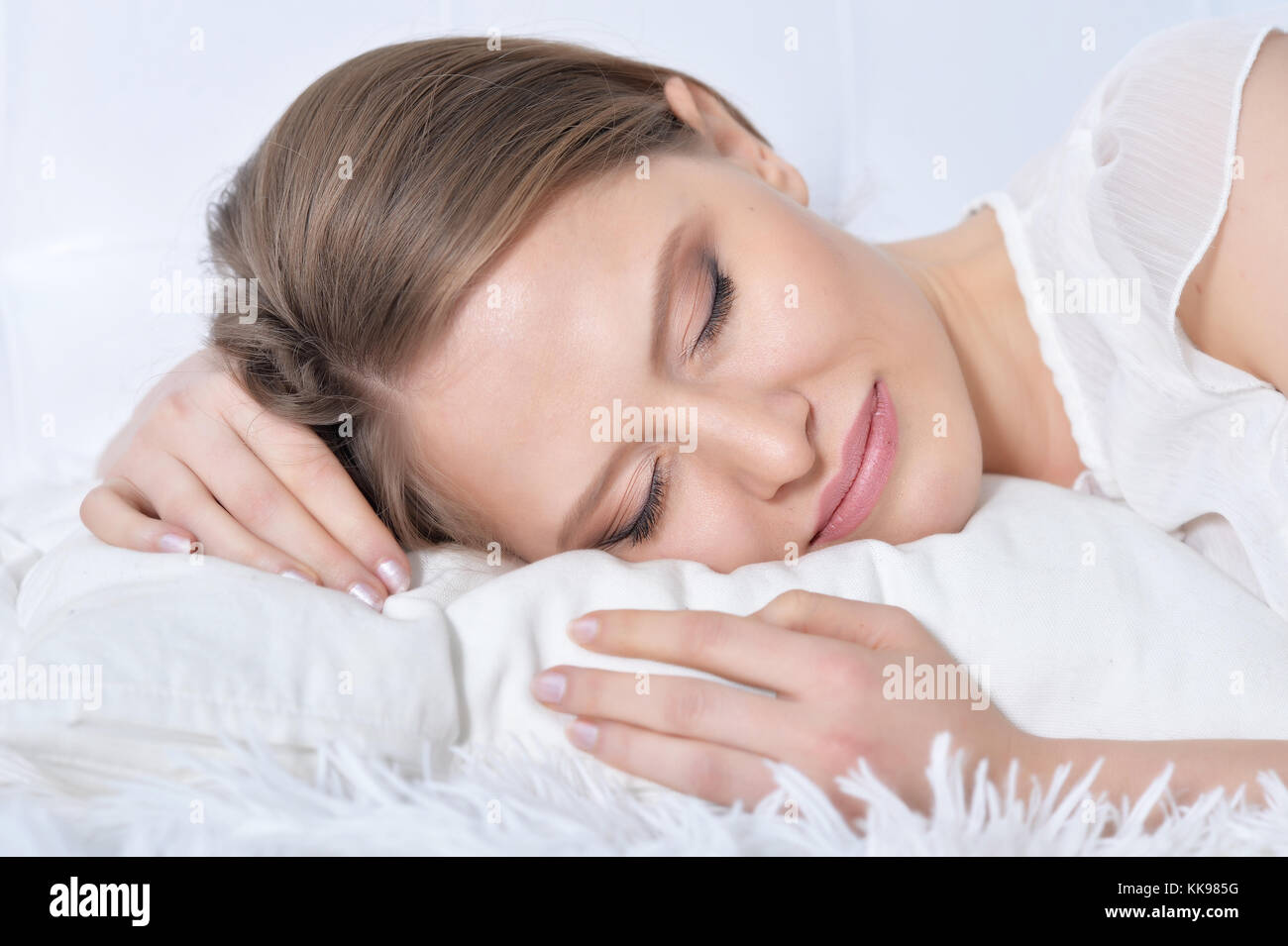 Young woman sleeping in bad Stock Photo - Alamy