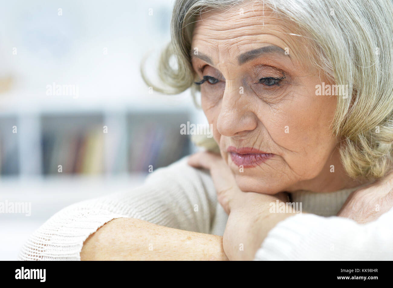Sad senior woman Stock Photo - Alamy