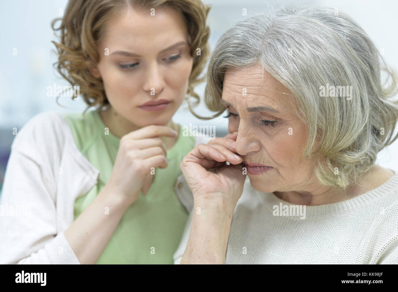 two sad women Stock Photo - Alamy