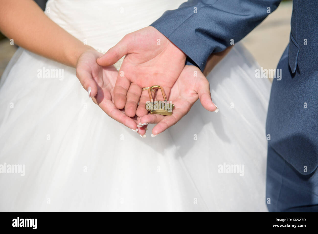 Wedding ceremony with padlock. Newly wedded with decorated padlock of ...
